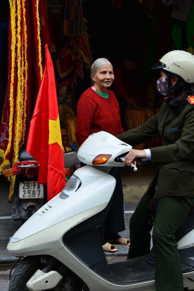 old woman and police officer speak together, Hanoi | a travel and ...